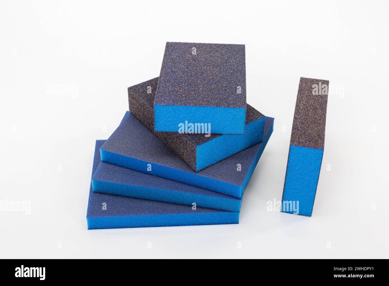 Various sanding sponges, sizes, grits, structures, white background ...
