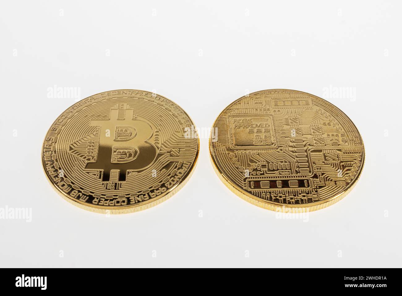 Two Bitcoin coins, front and back, white background Stock Photo - Alamy