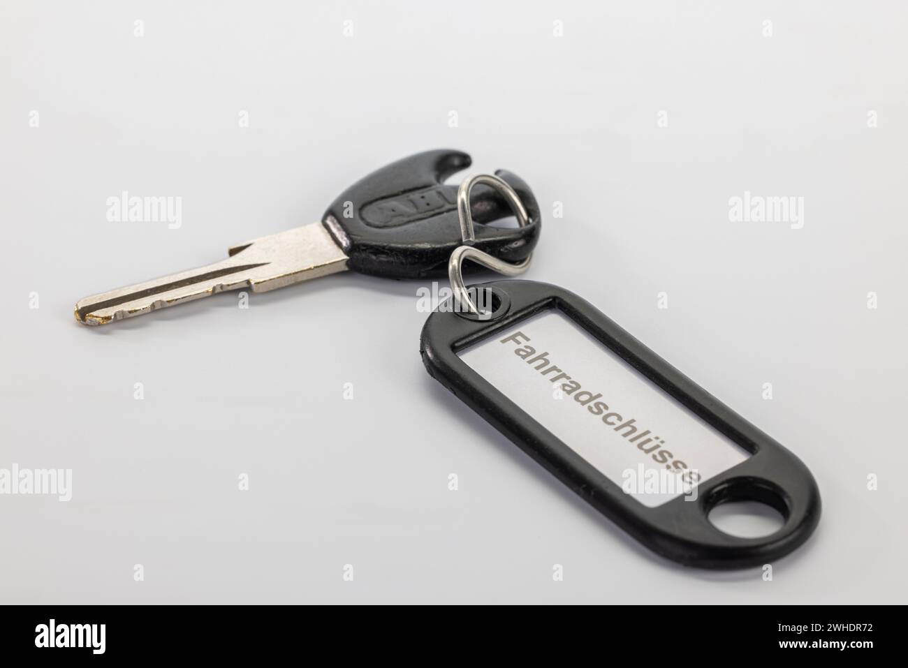 Bicycle key with black key ring, with lettering ëBicycle keyë, white ...