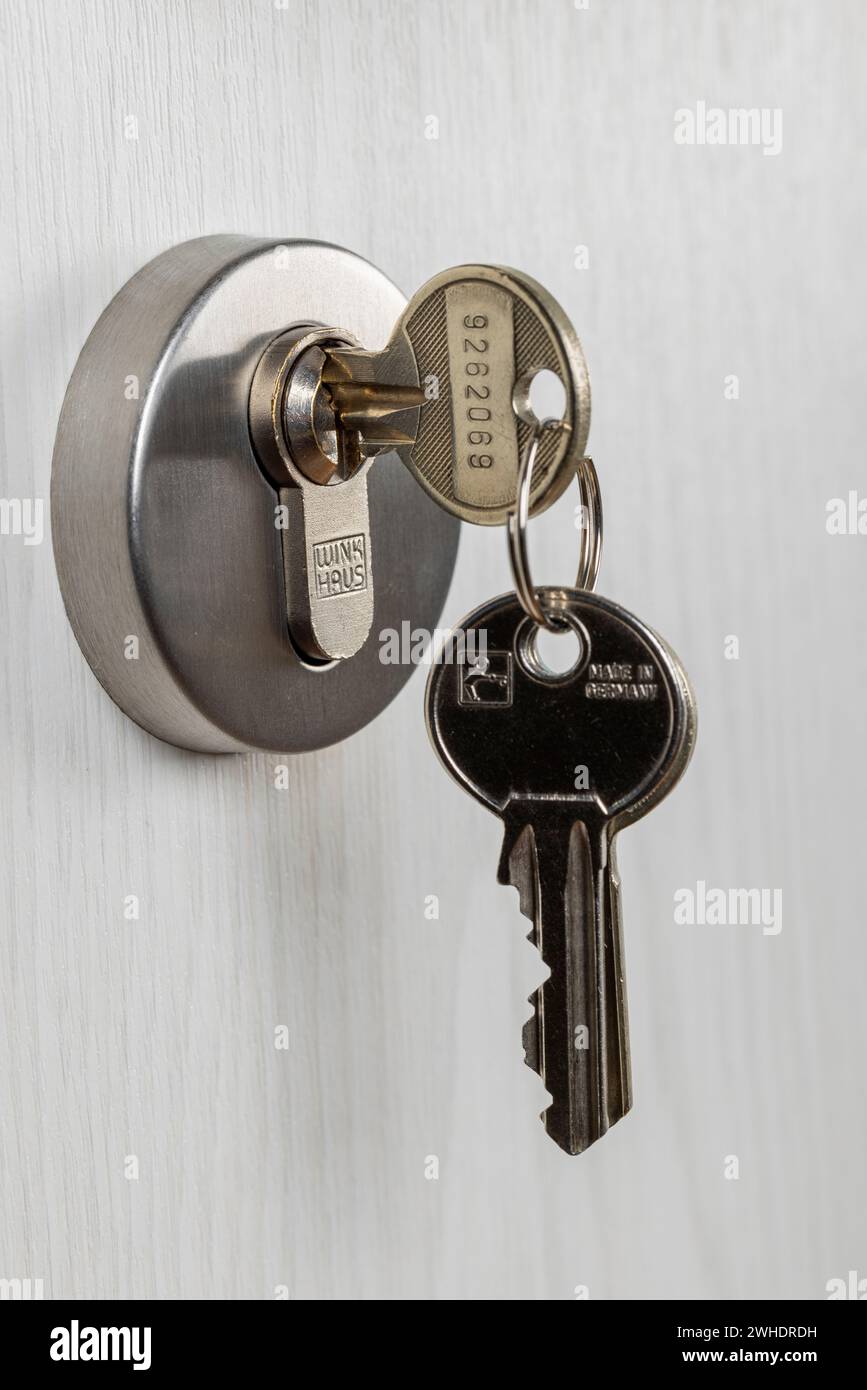 Key is in the door lock, bunch of keys Stock Photo - Alamy