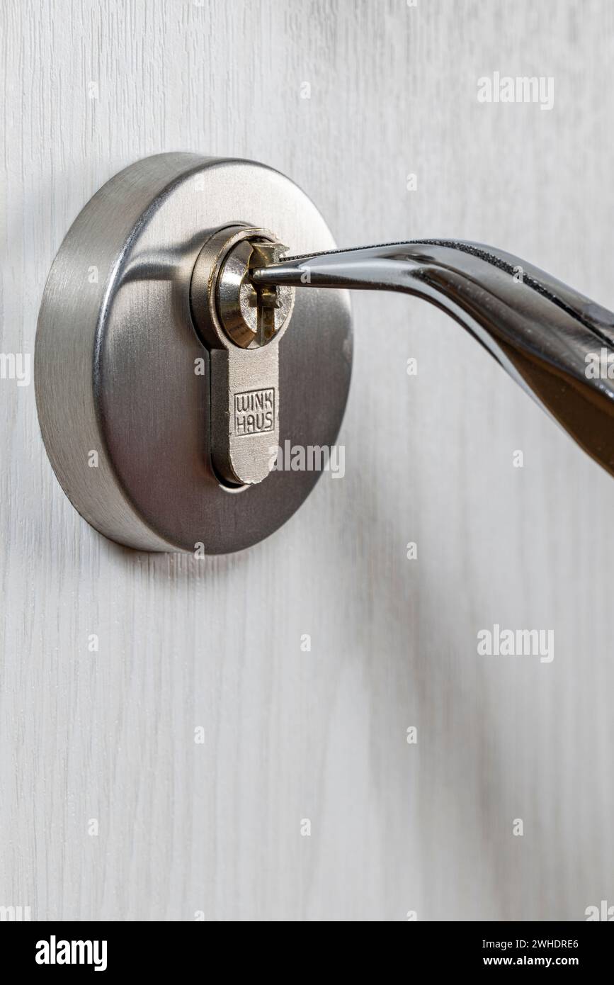 Broken key, pull out key bit with pliers, detail, symbolic image ...