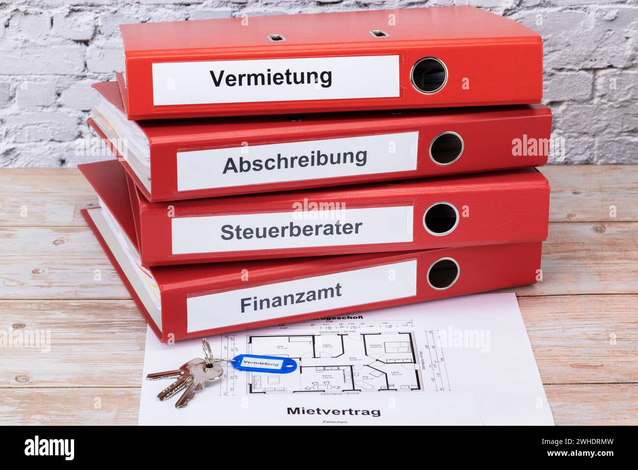 Red file folders labeled Rental, Depreciation, Tax consultant, Tax ...