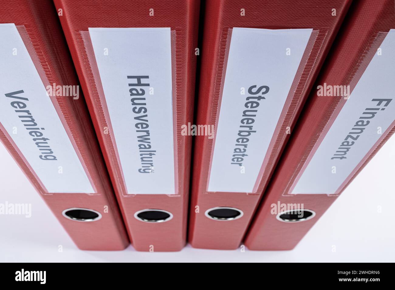 Red file folders labeled Rental, property management, tax consultant ...