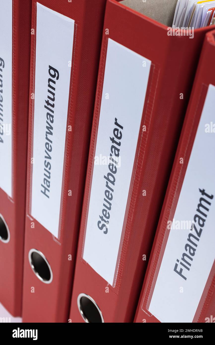 Red file folders labeled property management, tax consultant, tax ...