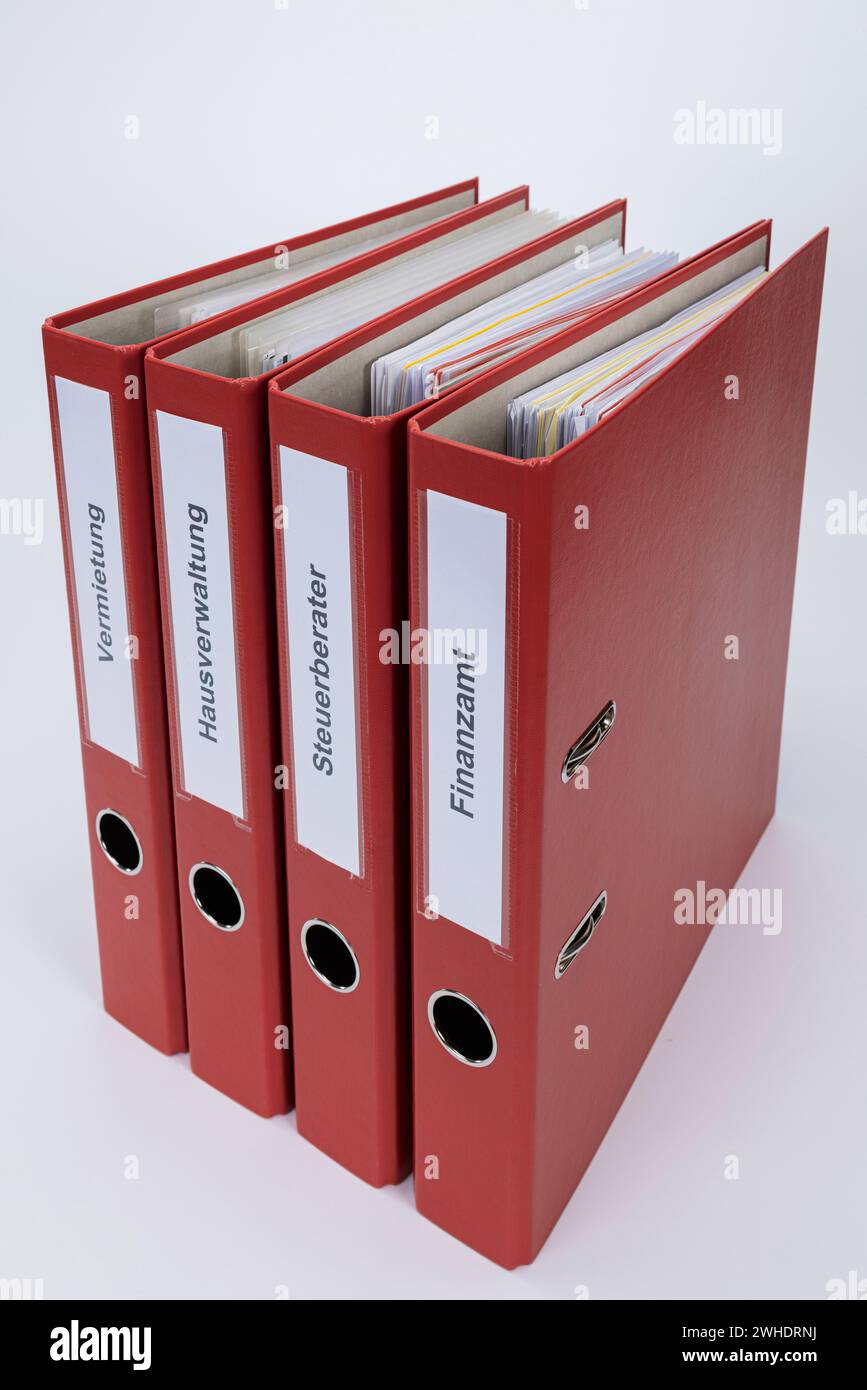 Red file folders labeled Rental, property management, tax consultant ...