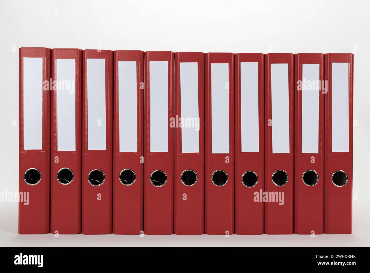 Red file folders without labeling, white background Stock Photo - Alamy