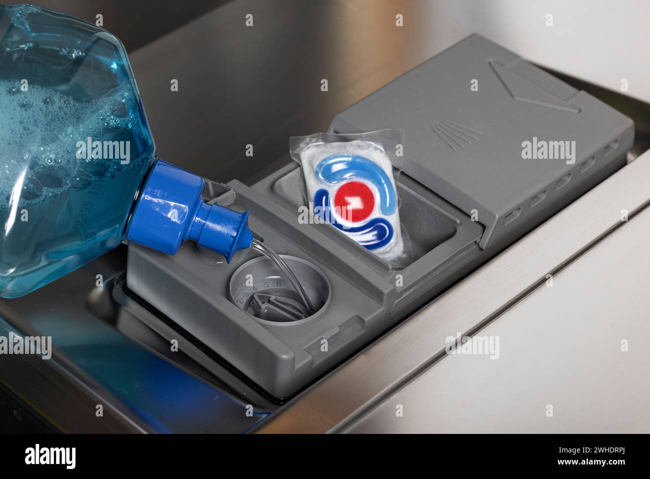 Filling the reservoir with rinse aid, detail, dishwasher Stock Photo ...