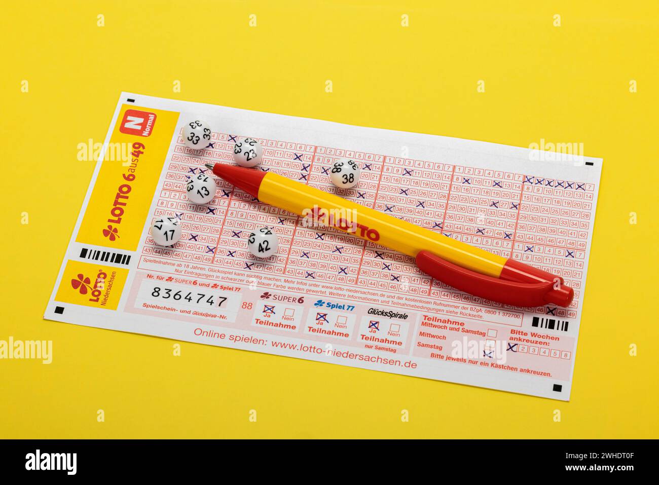 Lotto balls lying on completed lottery ticket, LOTTO 6aus49, lotto ...