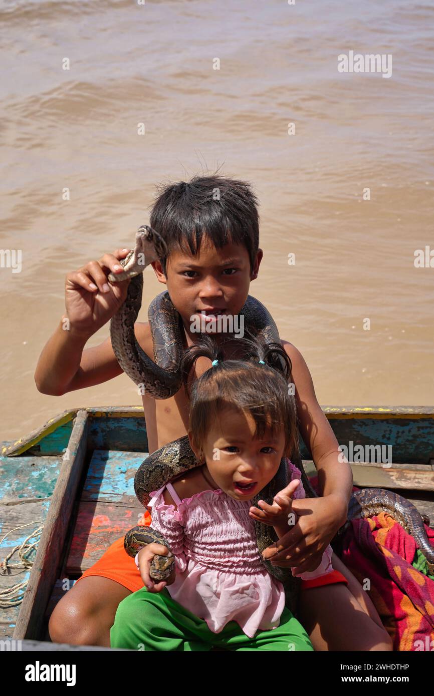 Siem Reap,Camboda,July 6, 2019-A young boy and girl eke out a living ...