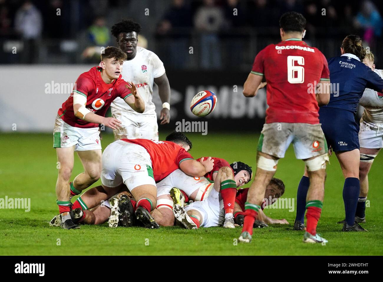 Wales' Ieuan Davies (left) releases the ball to team-mate Lucas de la ...