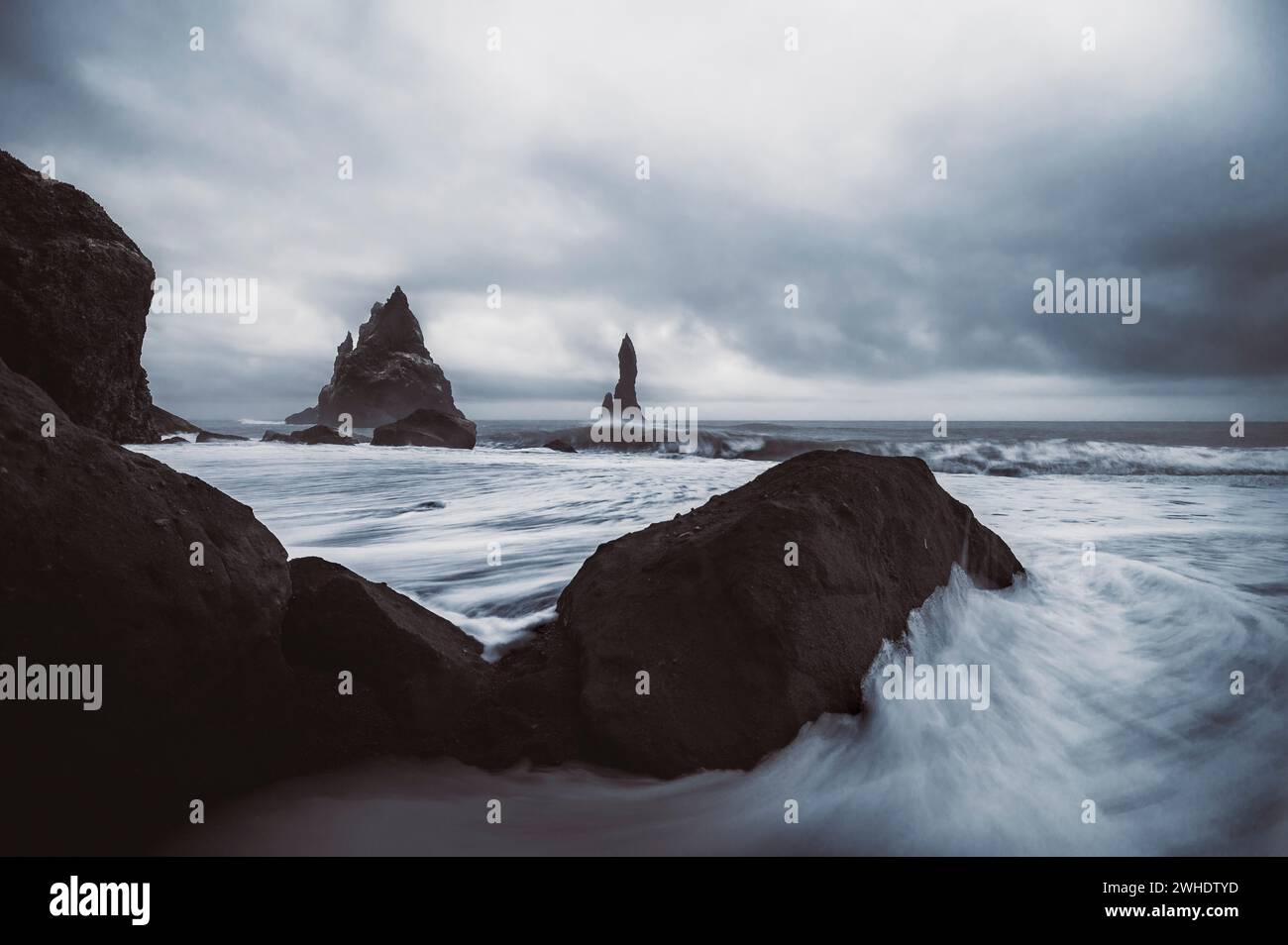 Reynisfjara beach in Iceland. Black sandy beach with basalt formations ...