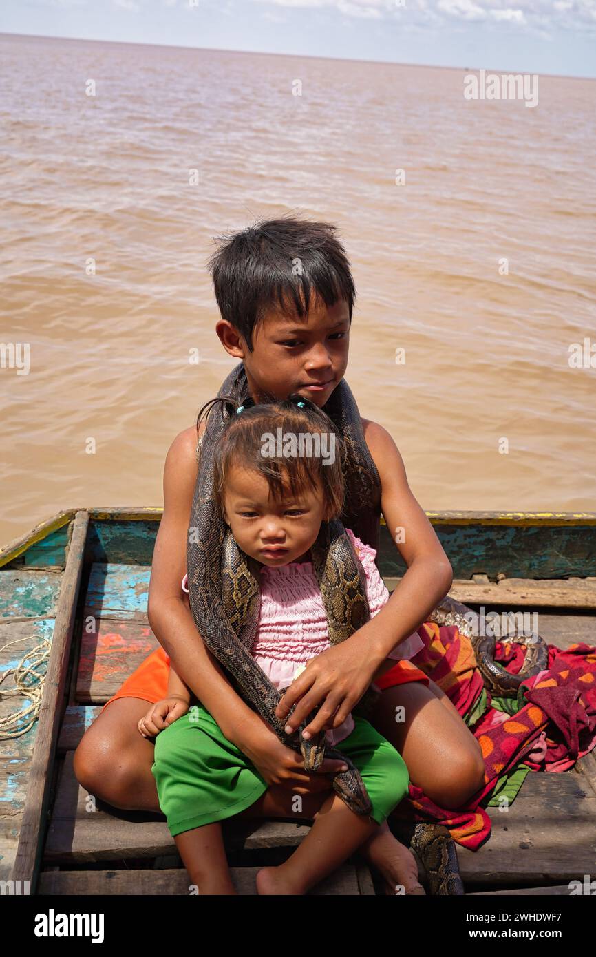 Siem Reap,Camboda,July 6, 2019-A young boy and girl eke out a living ...