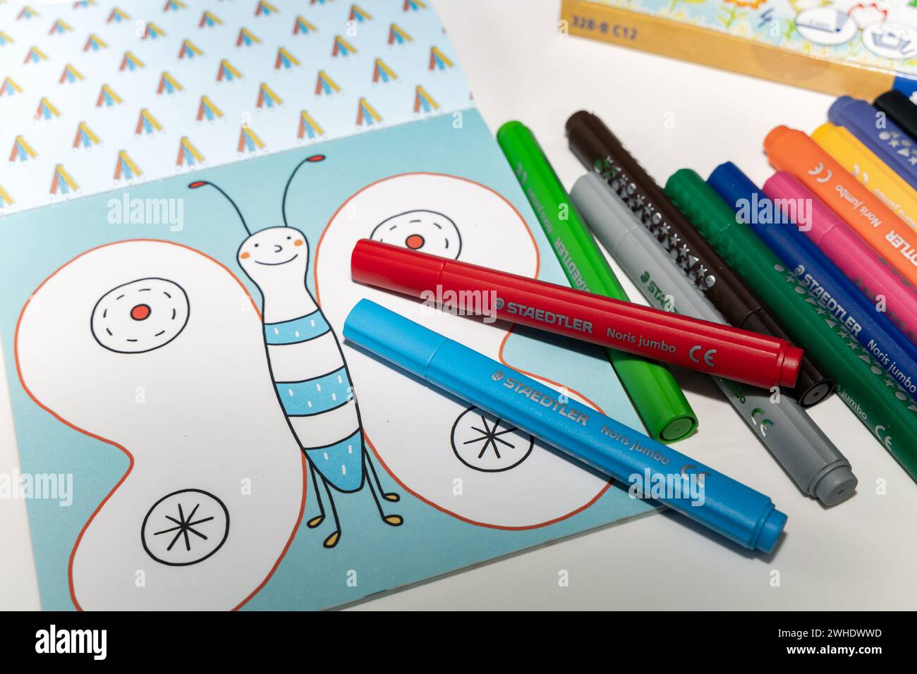 Colored markers for drawing various colors and coloring book for ...