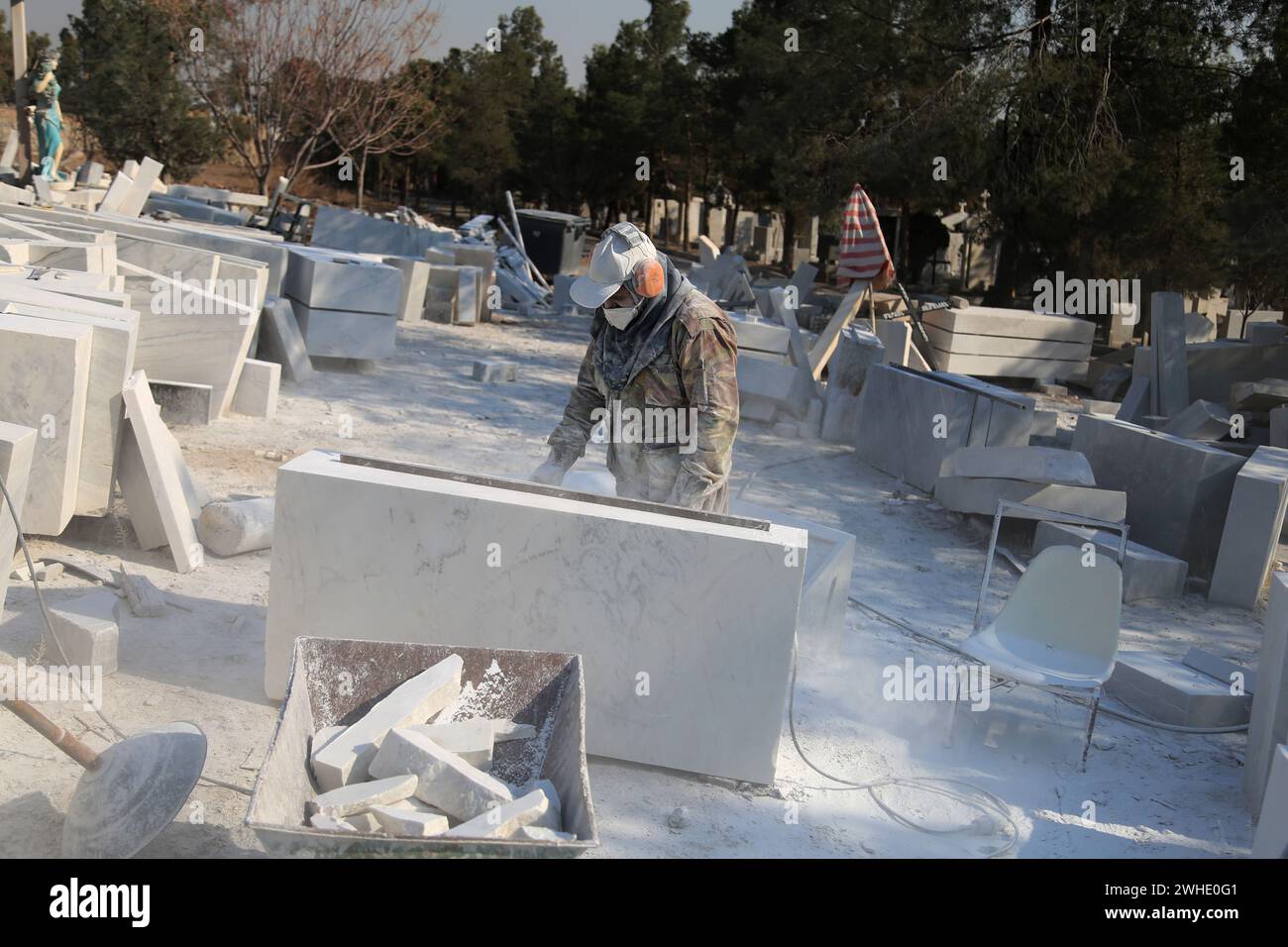 Tehran, Iran. 8th Feb, 2024. An Iranian worker carving a gravestone at ...