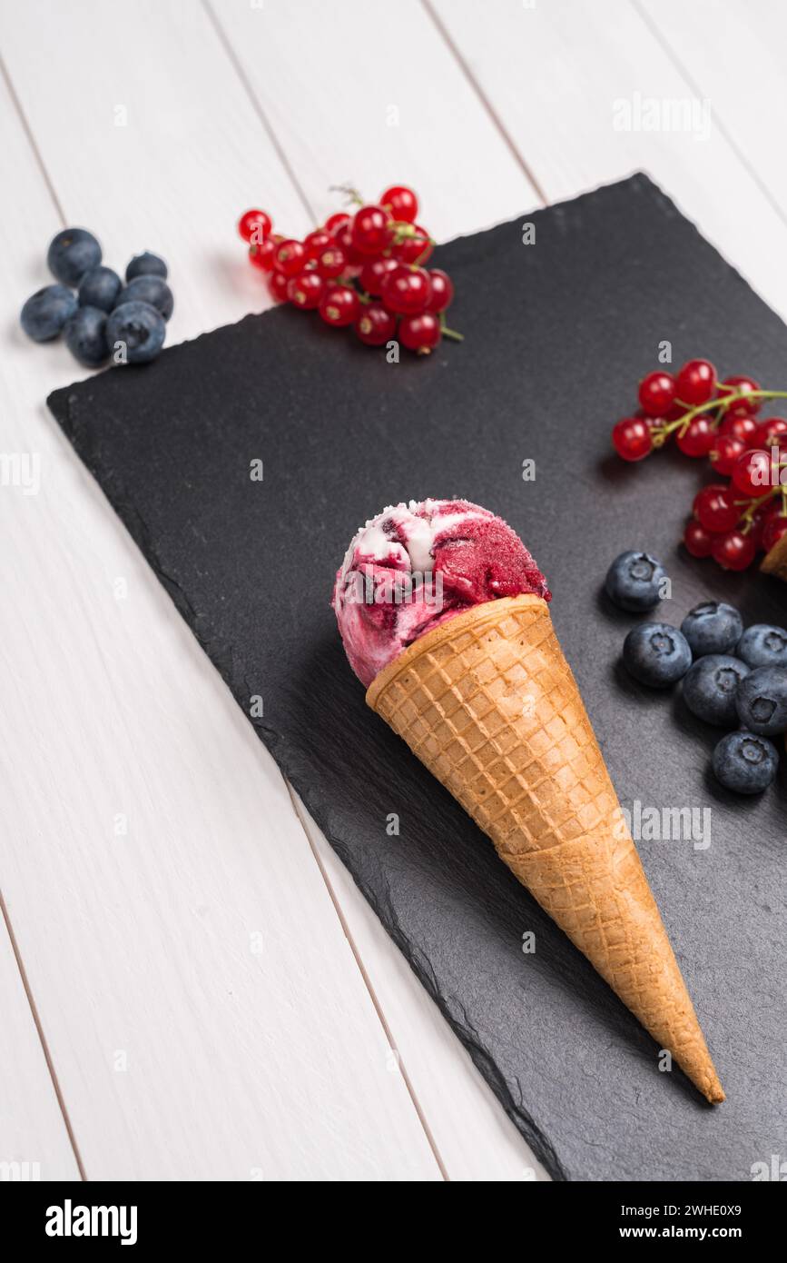 Berry ice cream cone Stock Photo - Alamy