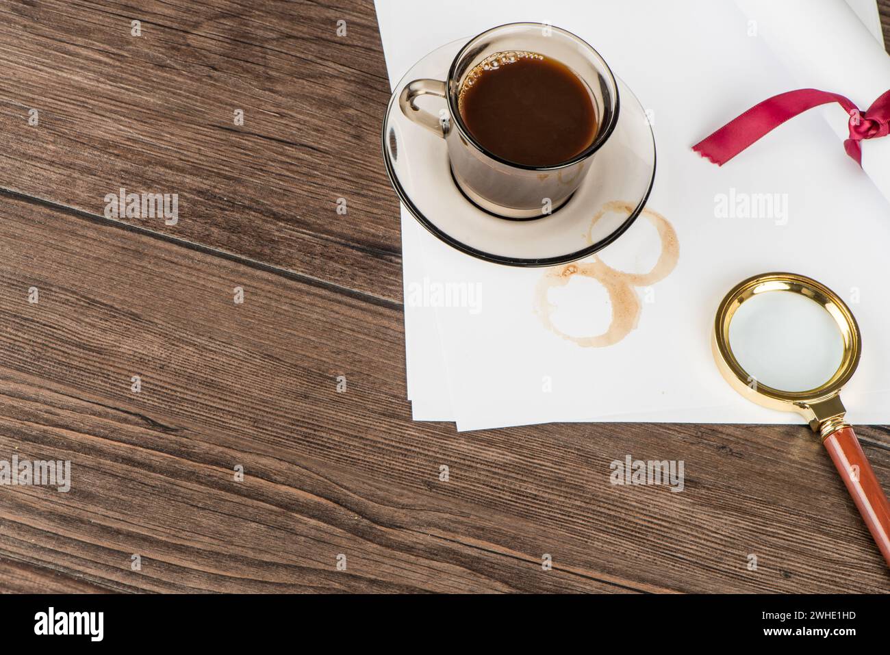 Coffee cup, paper sheets and detective hat Stock Photo - Alamy