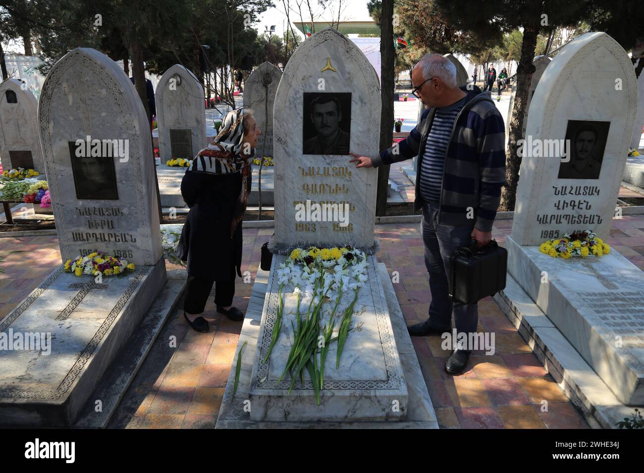 Tehran, Iran. 8th Feb, 2024. People visit gravestones of Armenian ...