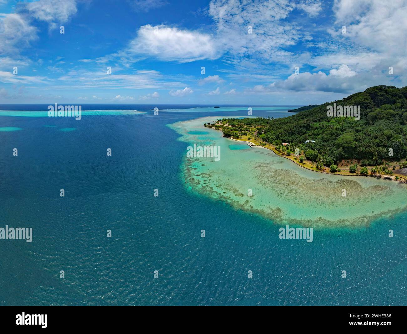 Aerial view of the coral reef, South Pacific Ocean, and the island of ...