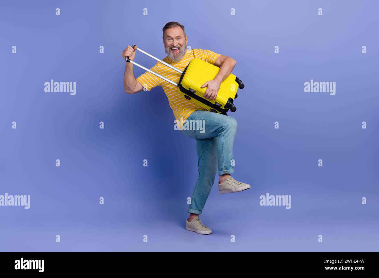 Full length portrait of overjoyed cheerful person hands hold suitcase ...