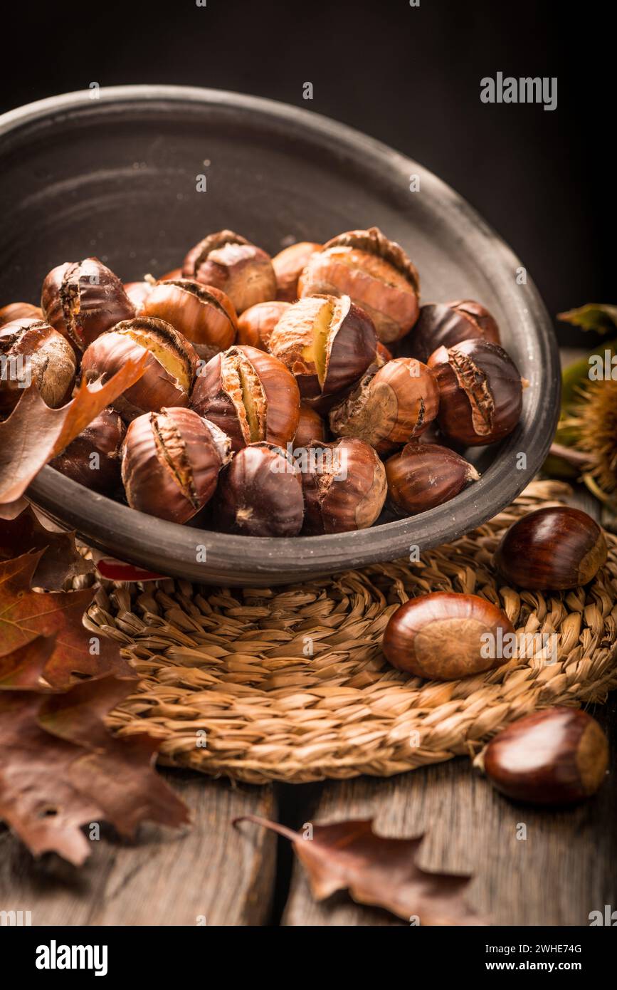 Roasted chestnuts and leaves Stock Photo - Alamy