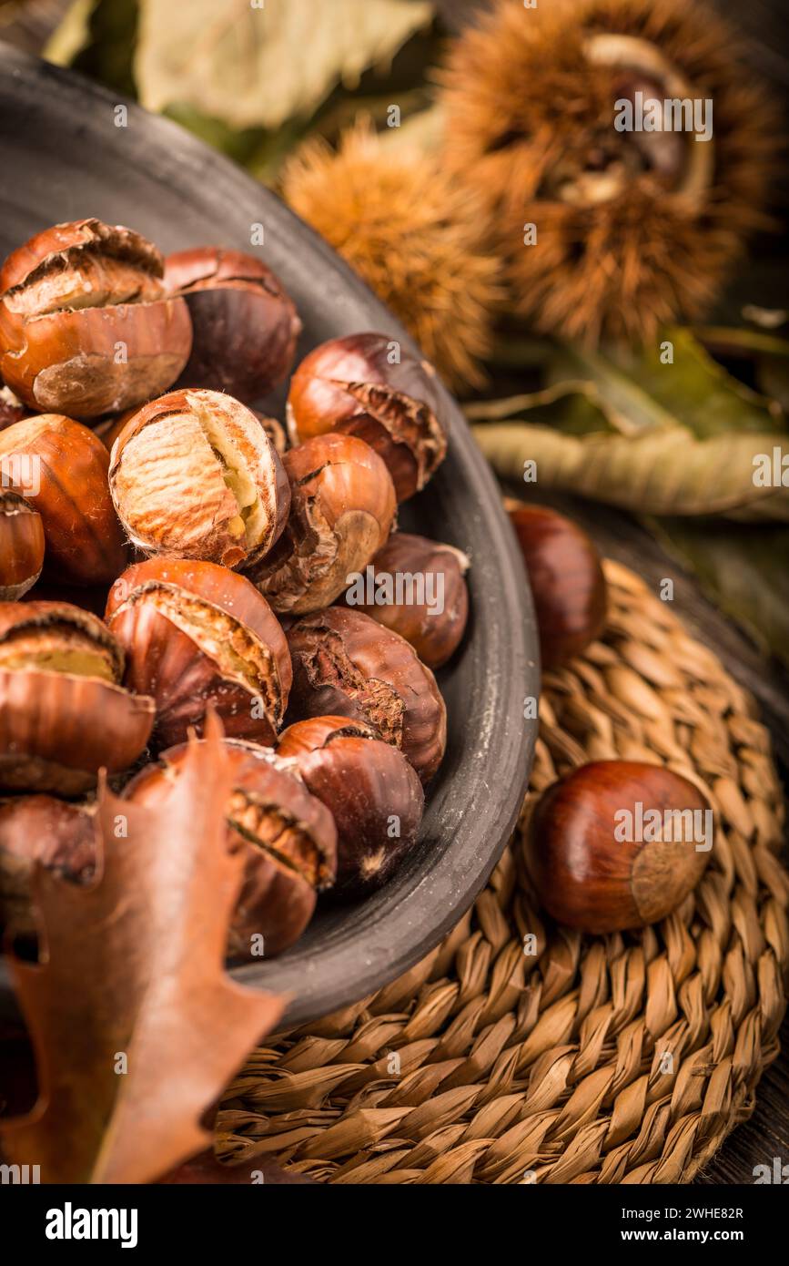 Roasted chestnuts and leaves Stock Photo - Alamy