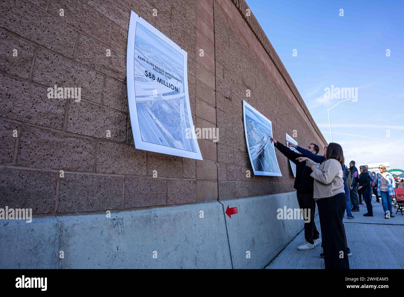 Bakersfield, USA. 09th Feb, 2024. Several people gather to view poster ...