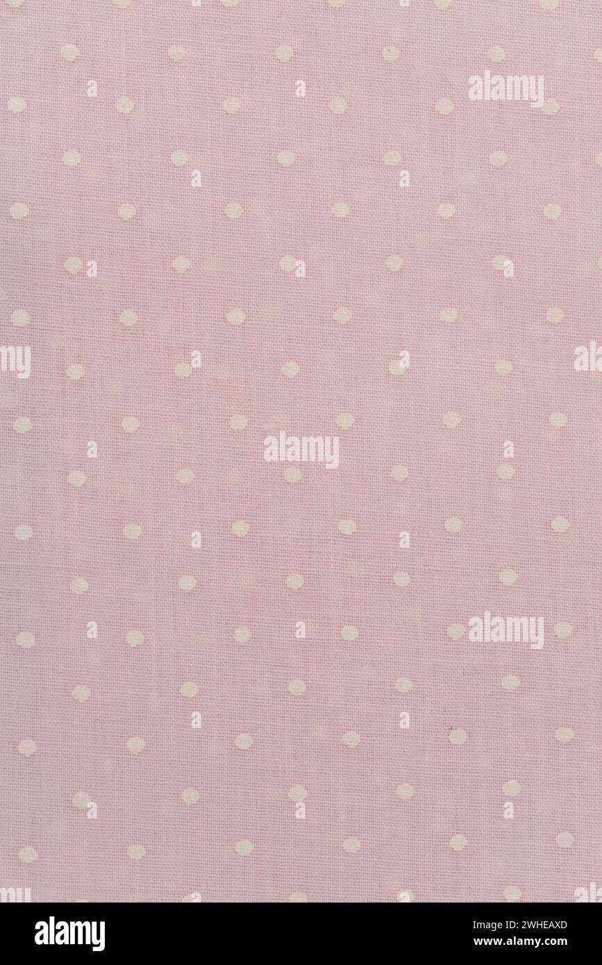 Pink and white spot pattern fabric Stock Photo - Alamy