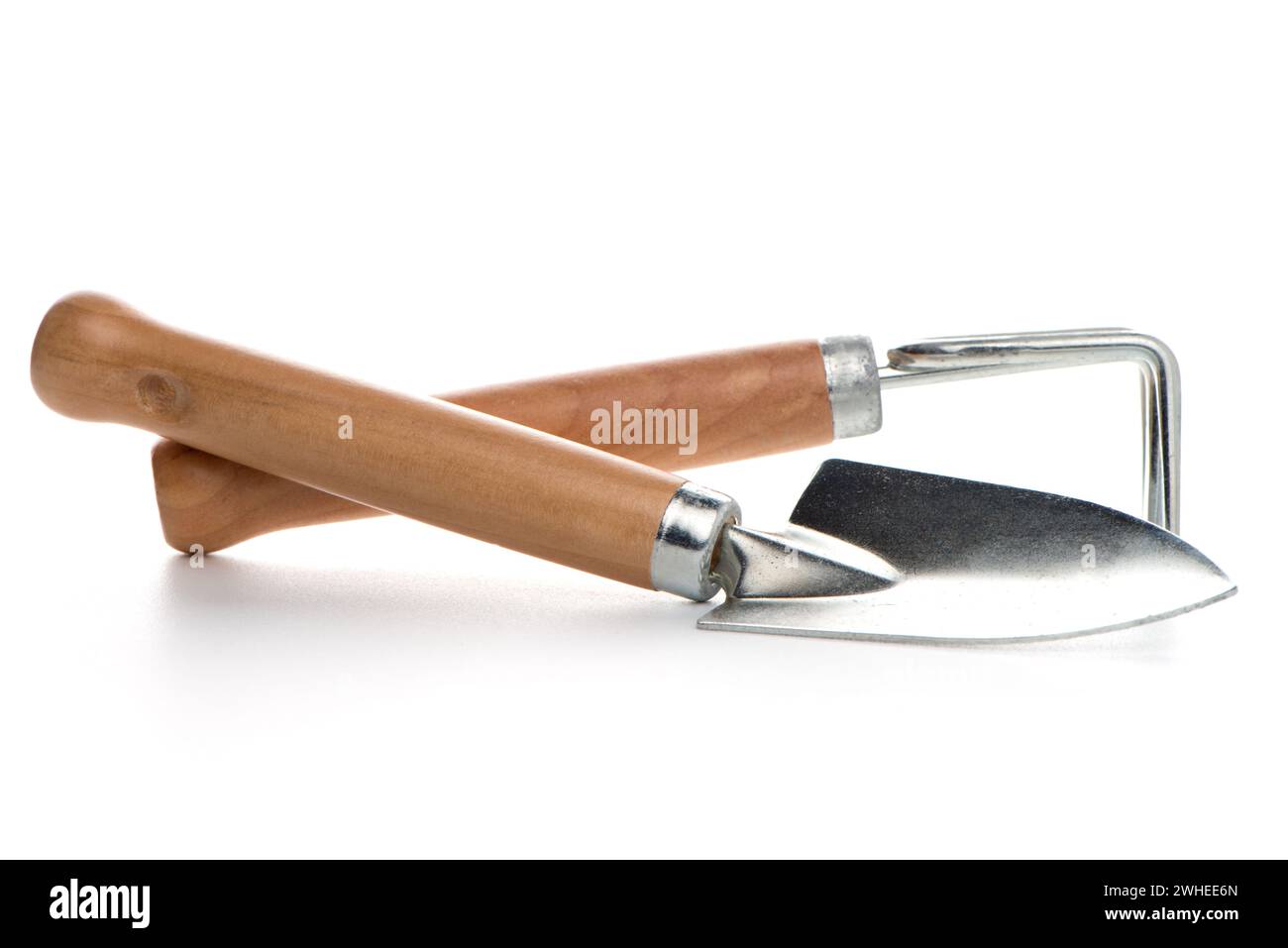 Small gardening shovel and fork Stock Photo - Alamy