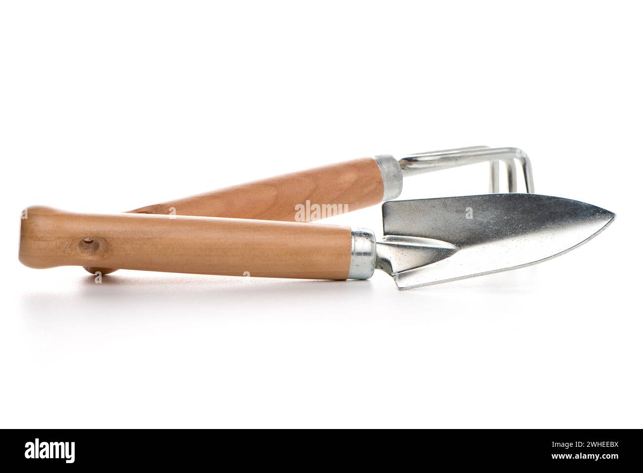 Small gardening shovel and fork Stock Photo - Alamy