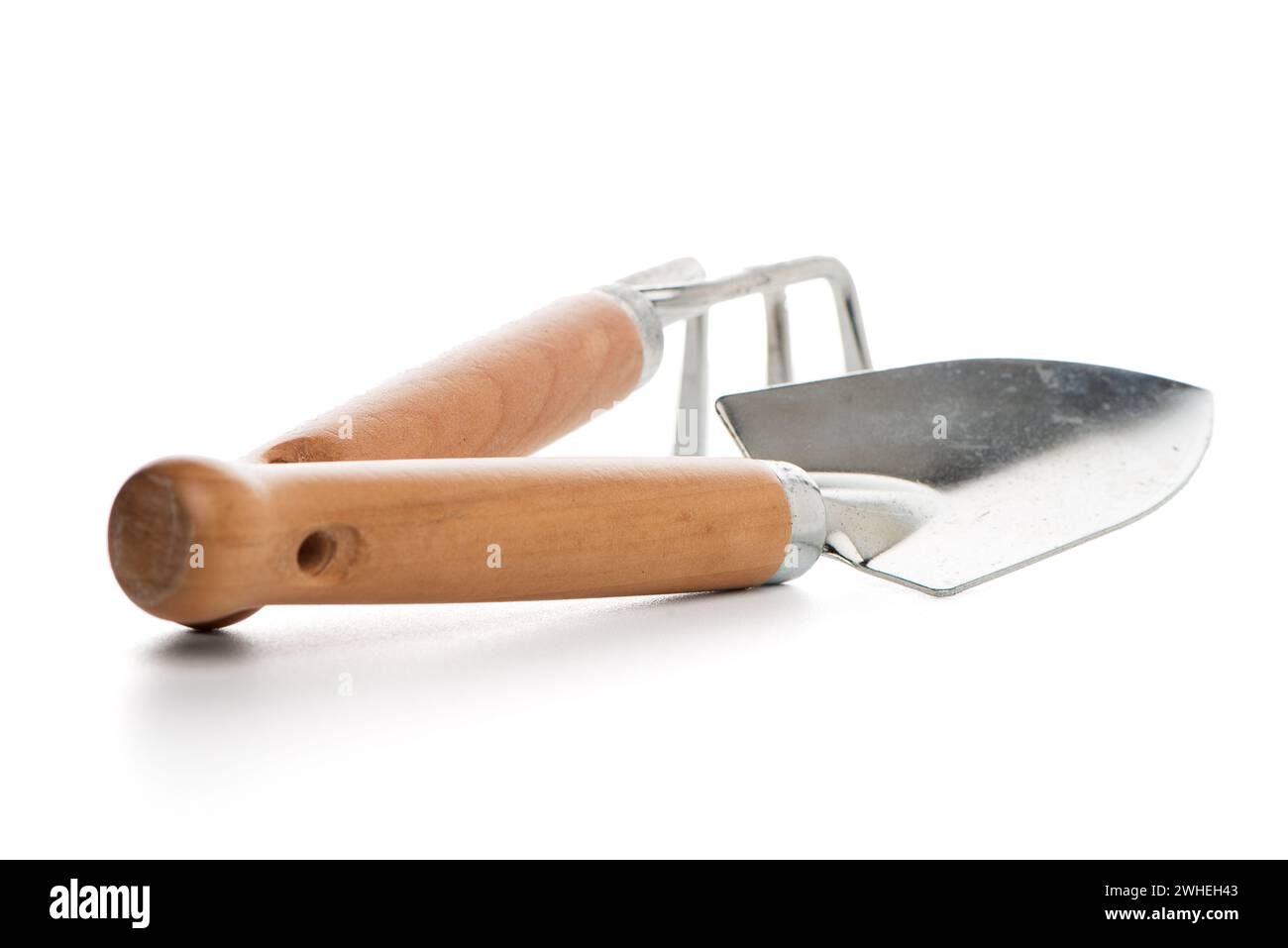 Small gardening shovel and fork Stock Photo - Alamy