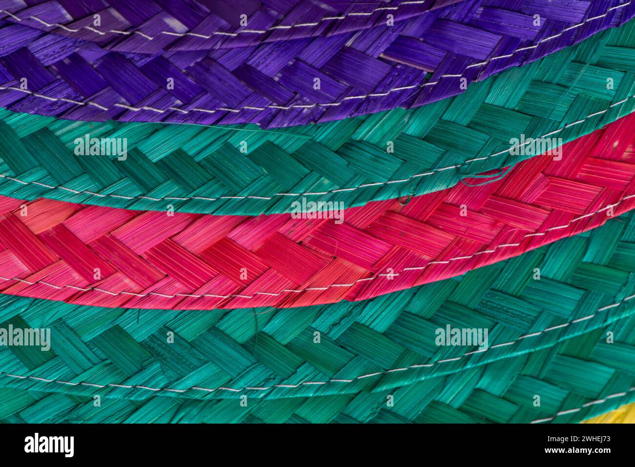 Colorful background of woven straw Stock Photo - Alamy