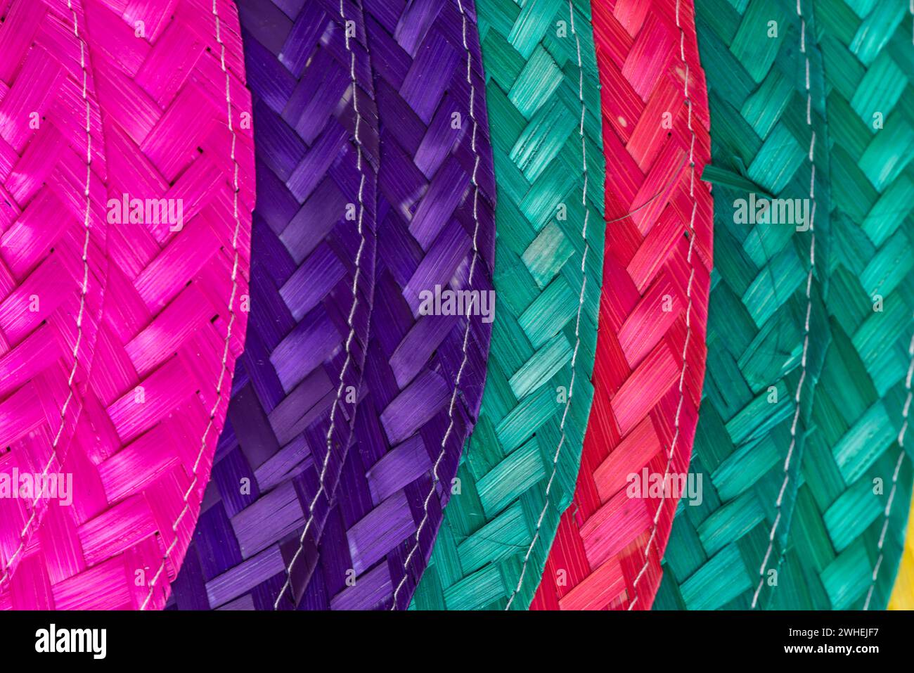Colorful background of woven straw Stock Photo - Alamy