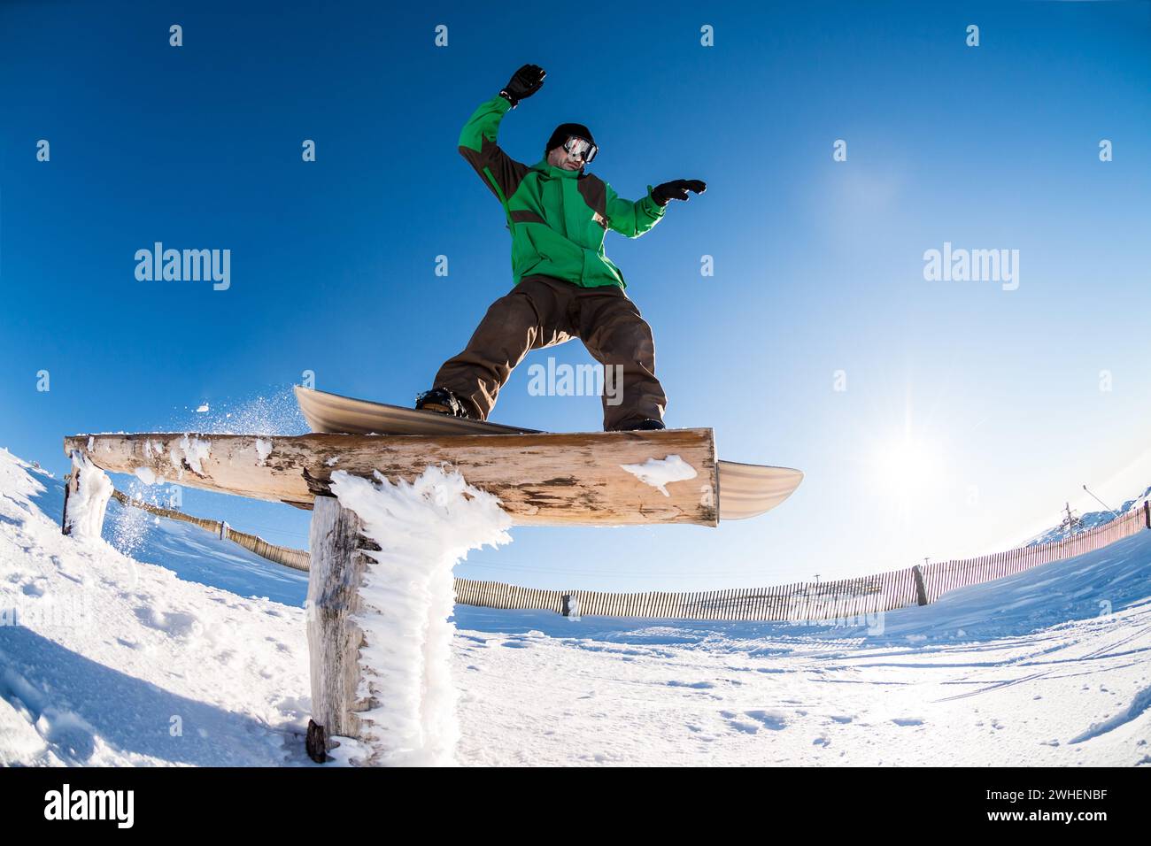 Snowboarder sliding on rail hi-res stock photography and images - Alamy