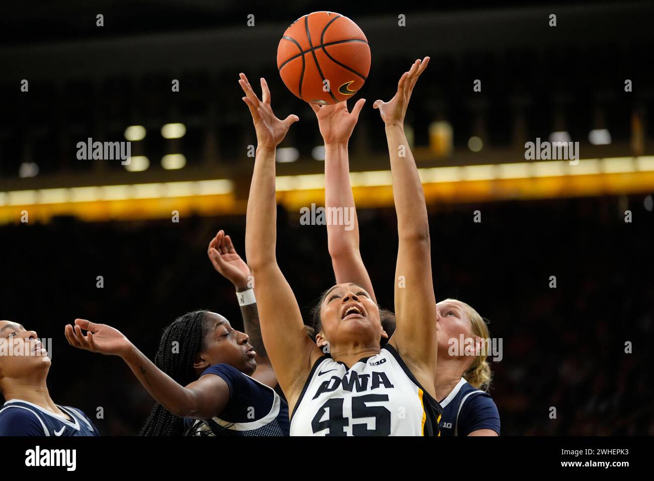 Iowa forward Hannah Stuelke (45) fights for a rebound during the first ...