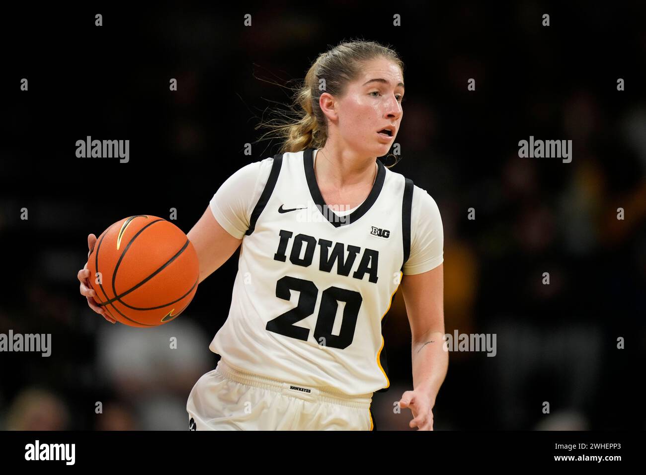 Iowa guard Kate Martin (20) drives up court during the first half of an ...