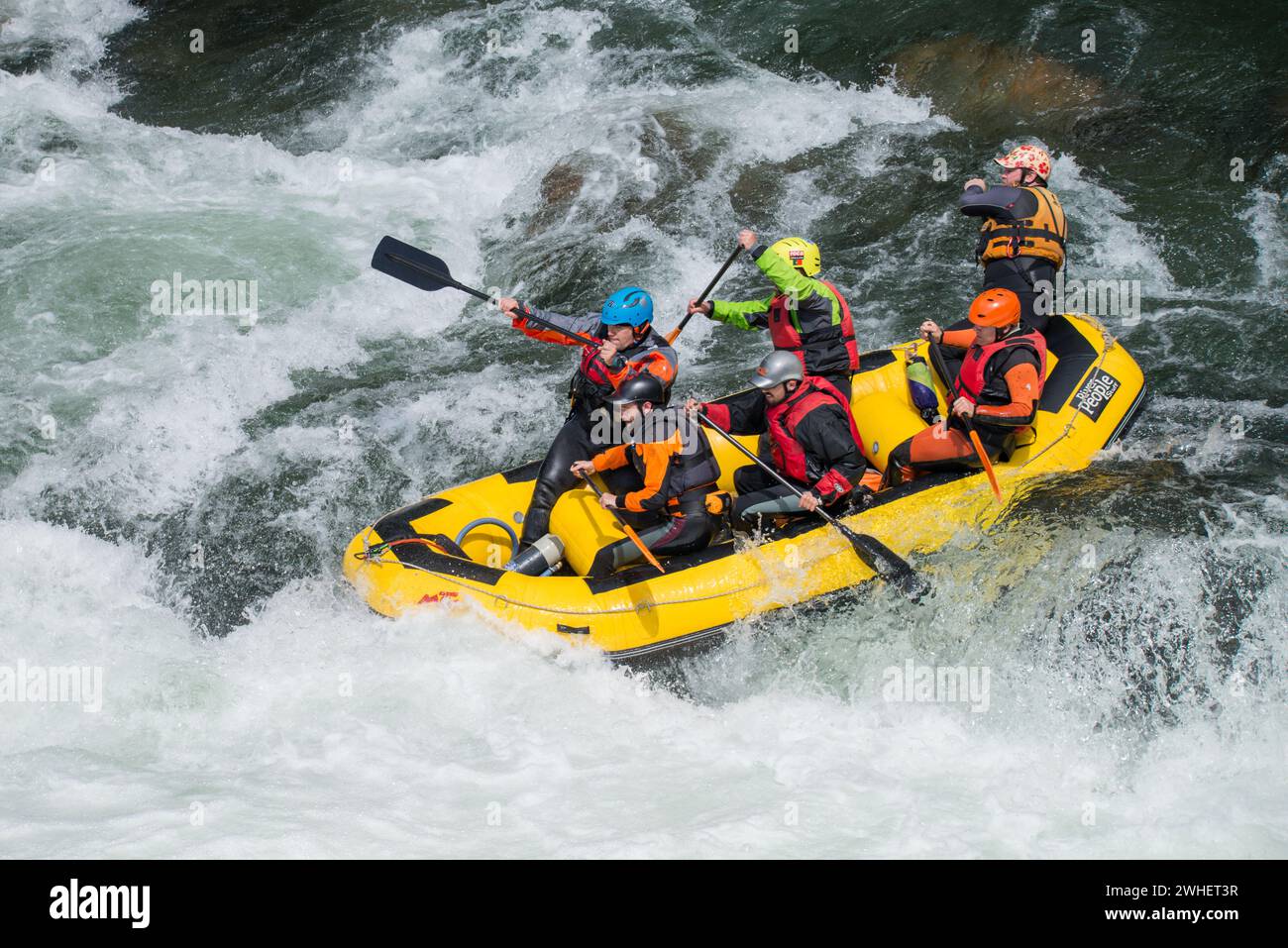 Yellow raft team Stock Photo - Alamy