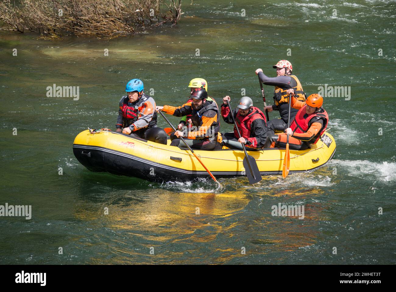 Yellow raft team Stock Photo - Alamy