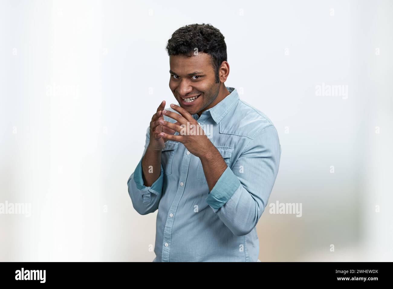 Cunning young man wearing blue shirt thinking about the adventure ...