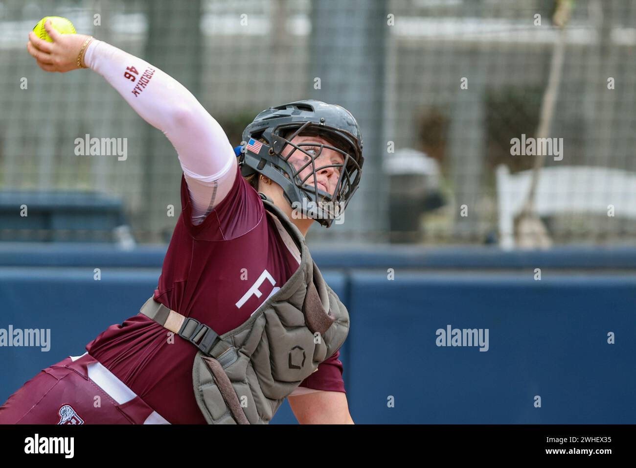 Fordham catcher Sydney Wells (46) throws to first during an NCAA ...