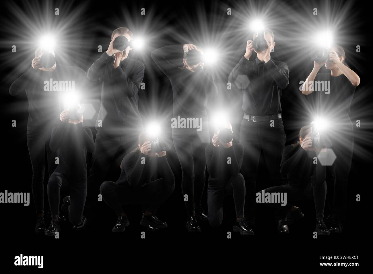 Group of photographers with cameras on black background. Paparazzi taking pictures with flashes ...