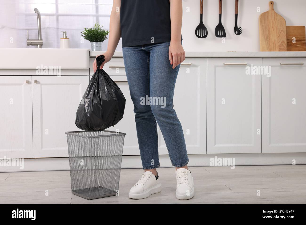 Taking out rubbish female hi-res stock photography and images - Alamy