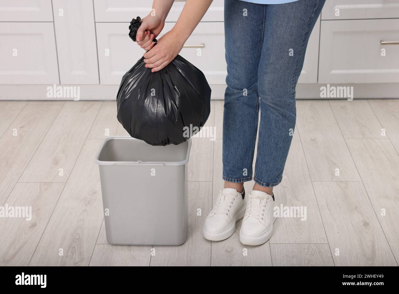 Taking out rubbish female hi-res stock photography and images - Alamy