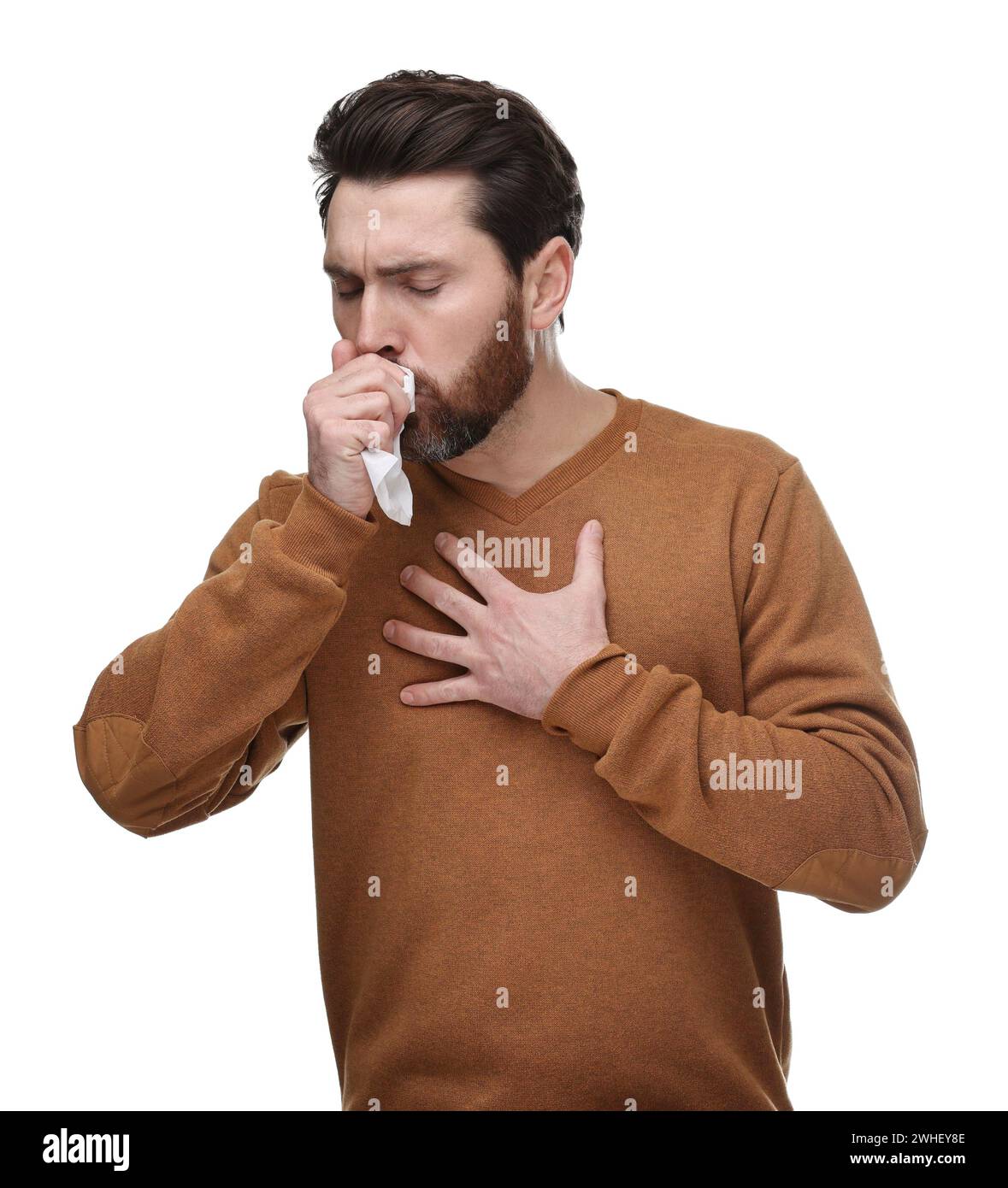 Sick man with tissue coughing on white background Stock Photo - Alamy