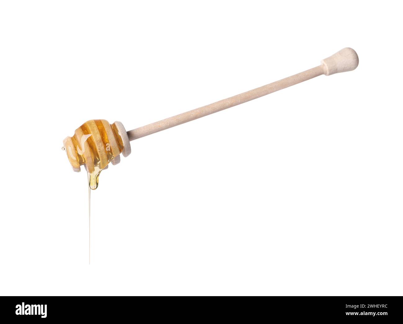 Fresh honey dripping from dipper on white background Stock Photo - Alamy