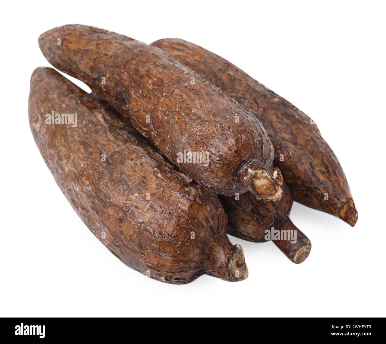 Many whole ripe cassava roots isolated on white Stock Photo - Alamy
