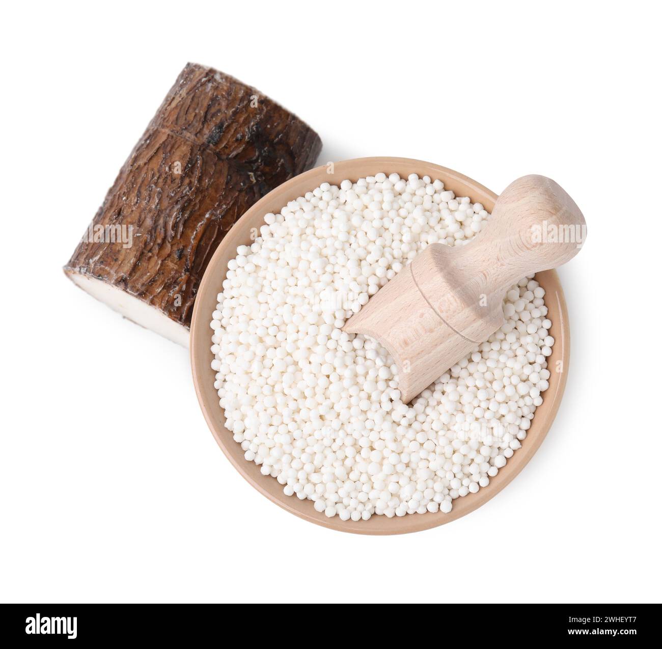 Tapioca pearls in bowl, scoop and cassava root isolated on white, top ...