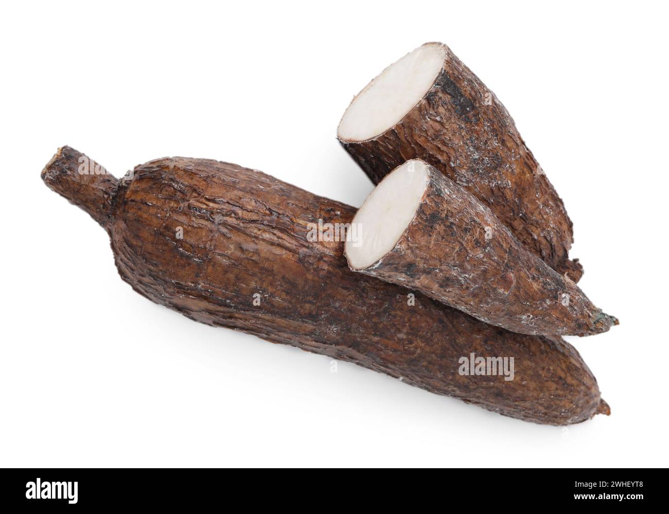 Whole and cut cassava roots isolated on white, top view Stock Photo - Alamy