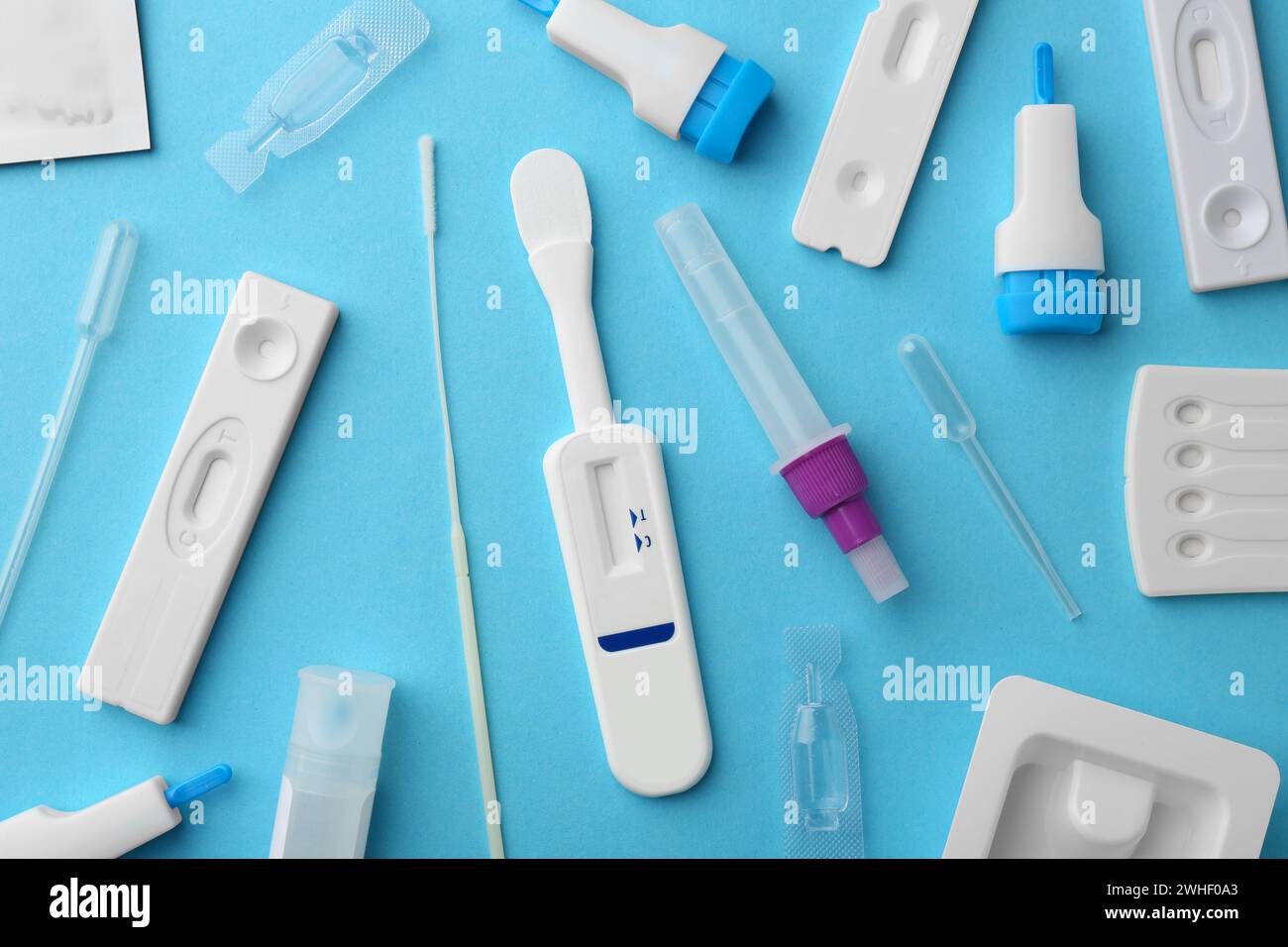 Disposable express test kits on light blue background, flat lay Stock ...