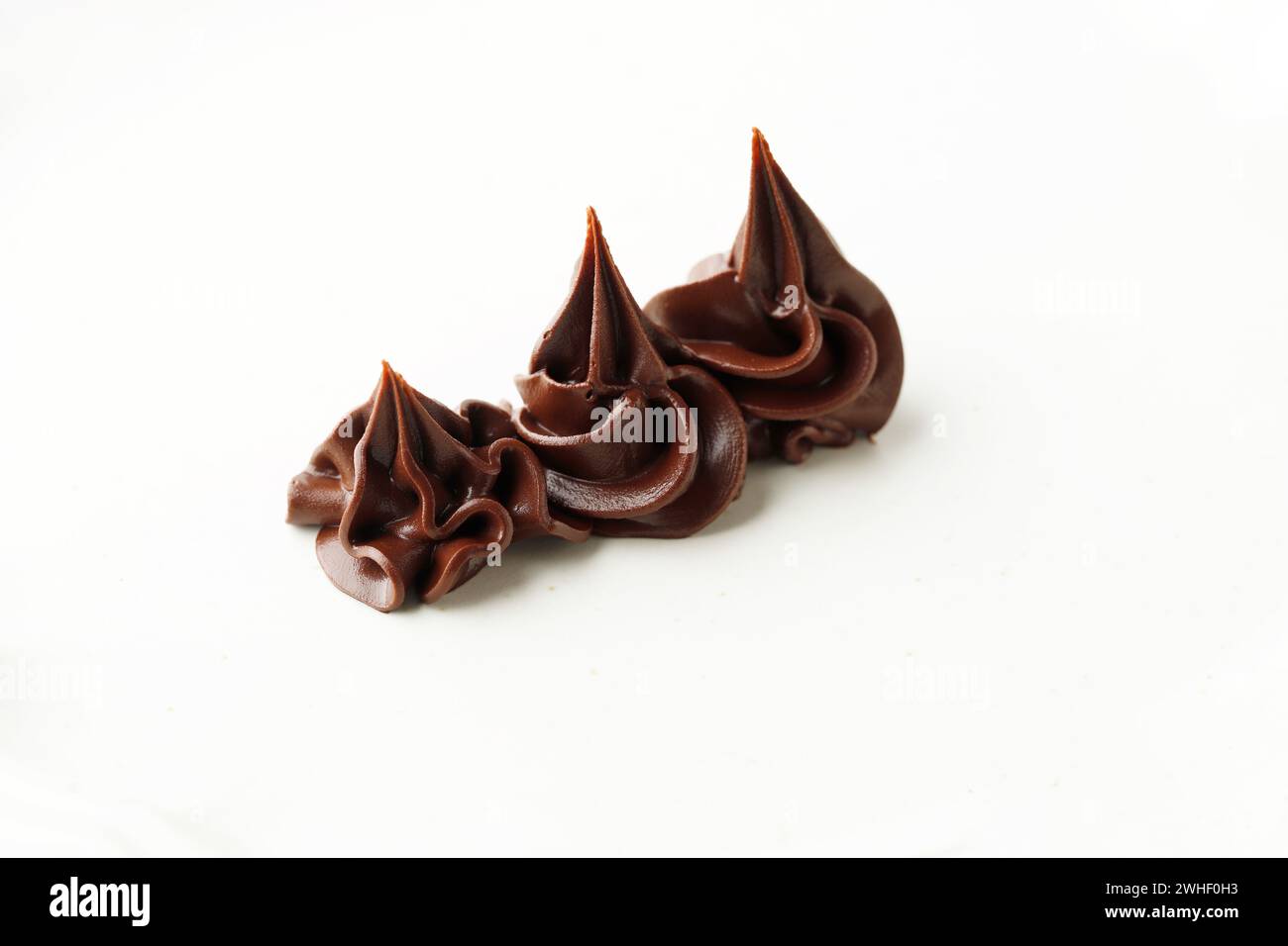 Chocolate Cream Swirl Isolated on White Background Stock Photo - Alamy