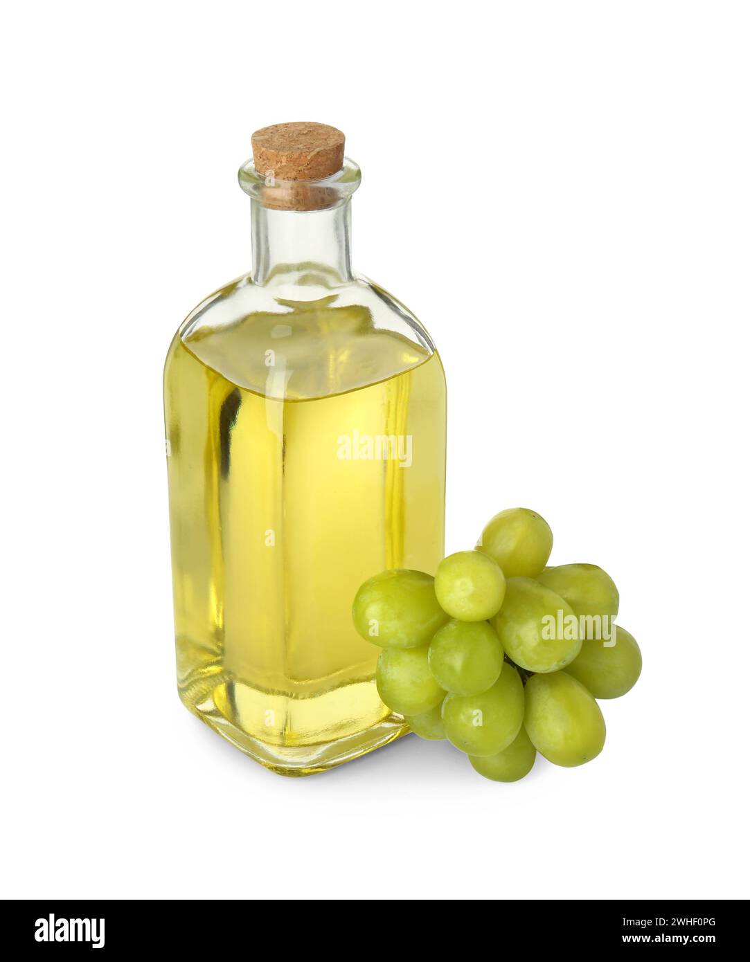 Vegetable fats. Bottle of cooking oil and fresh grapes isolated on ...